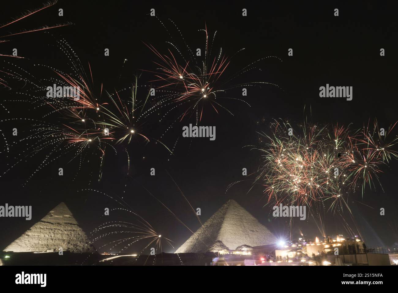 Fireworks spark over the historical site of Giza Pyramids, marking the ...