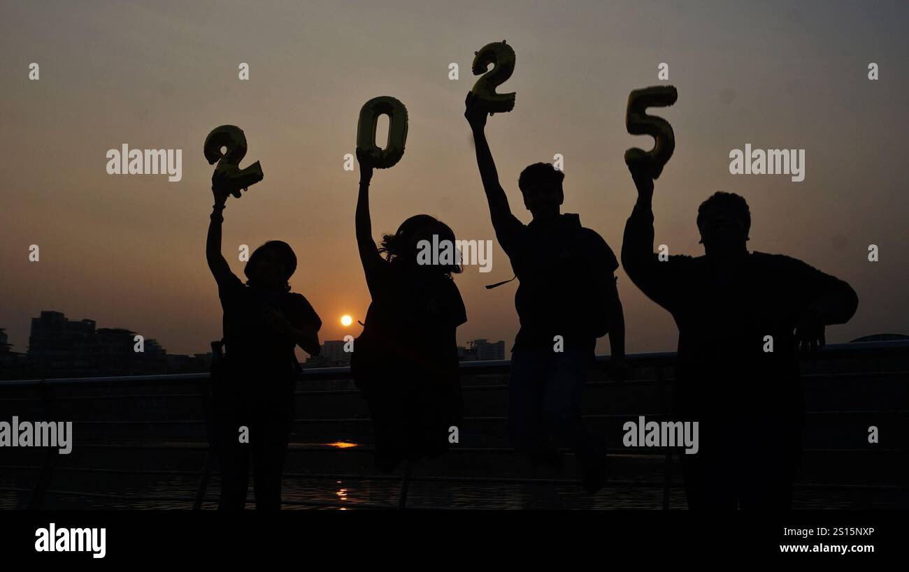 MUMBAI, INDIA - DECEMBER 31: A youths is seen welcoming the New Year ...