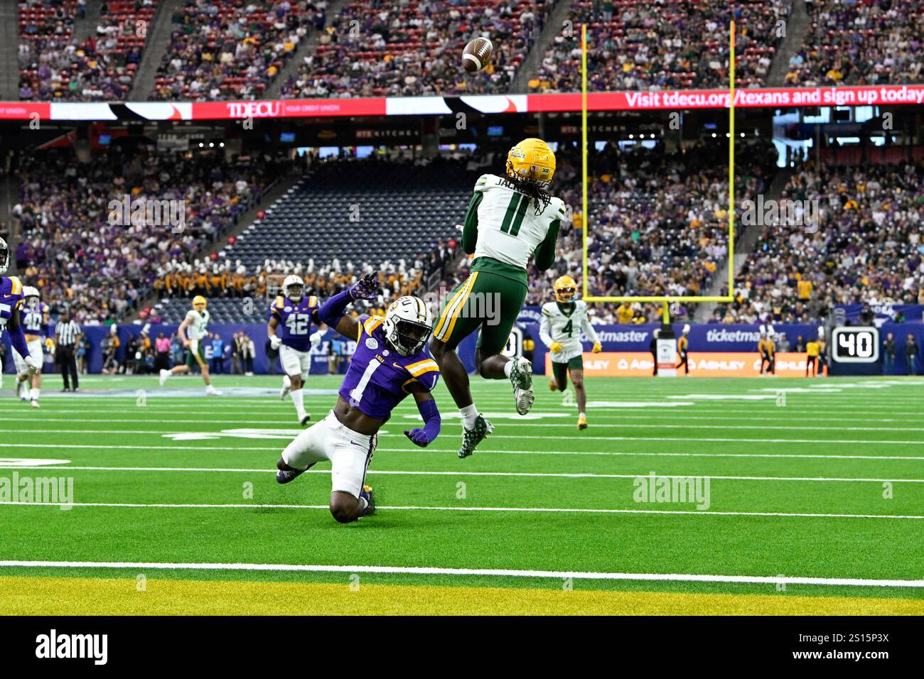 HOUSTON, TX - DECEMBER 31: Baylor Bears wide receiver Ketron Jackson Jr. (11) hauls in a deep ...