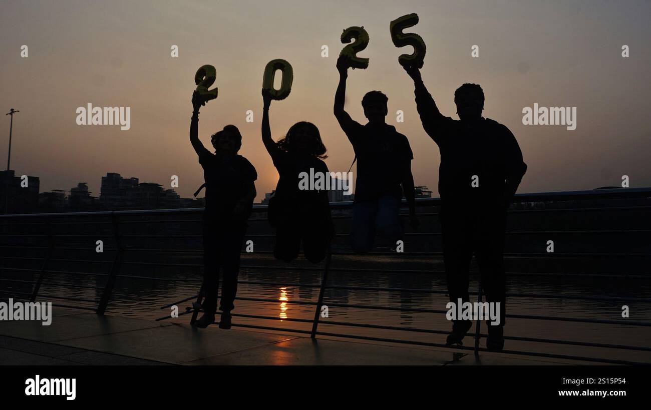MUMBAI, INDIA - DECEMBER 31: A youths is seen welcoming the New Year ...