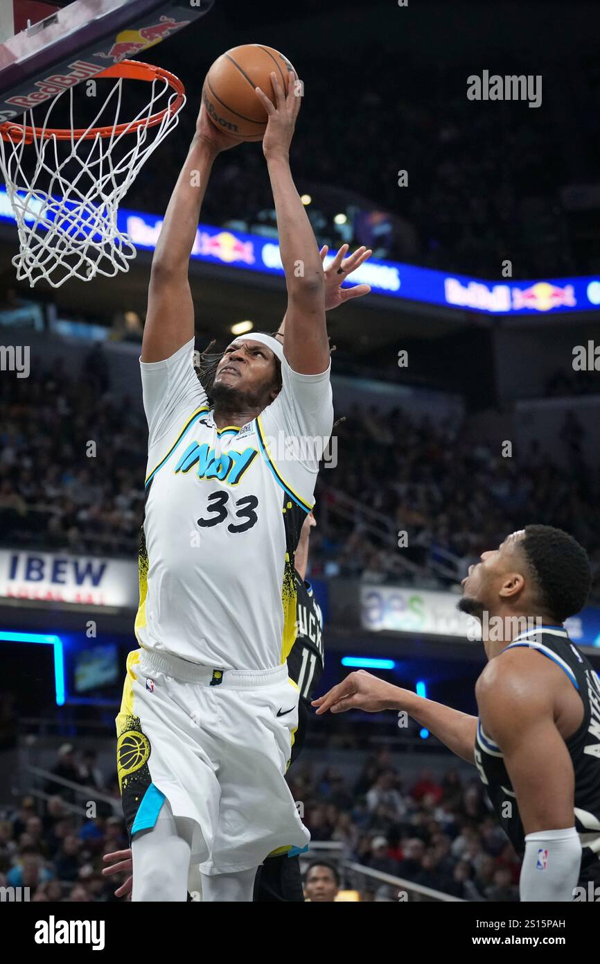 Indiana Pacers center Myles Turner (33) dunks in front of Milwaukee ...