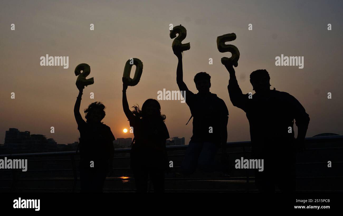 MUMBAI, INDIA - DECEMBER 31: A youths is seen welcoming the New Year ...