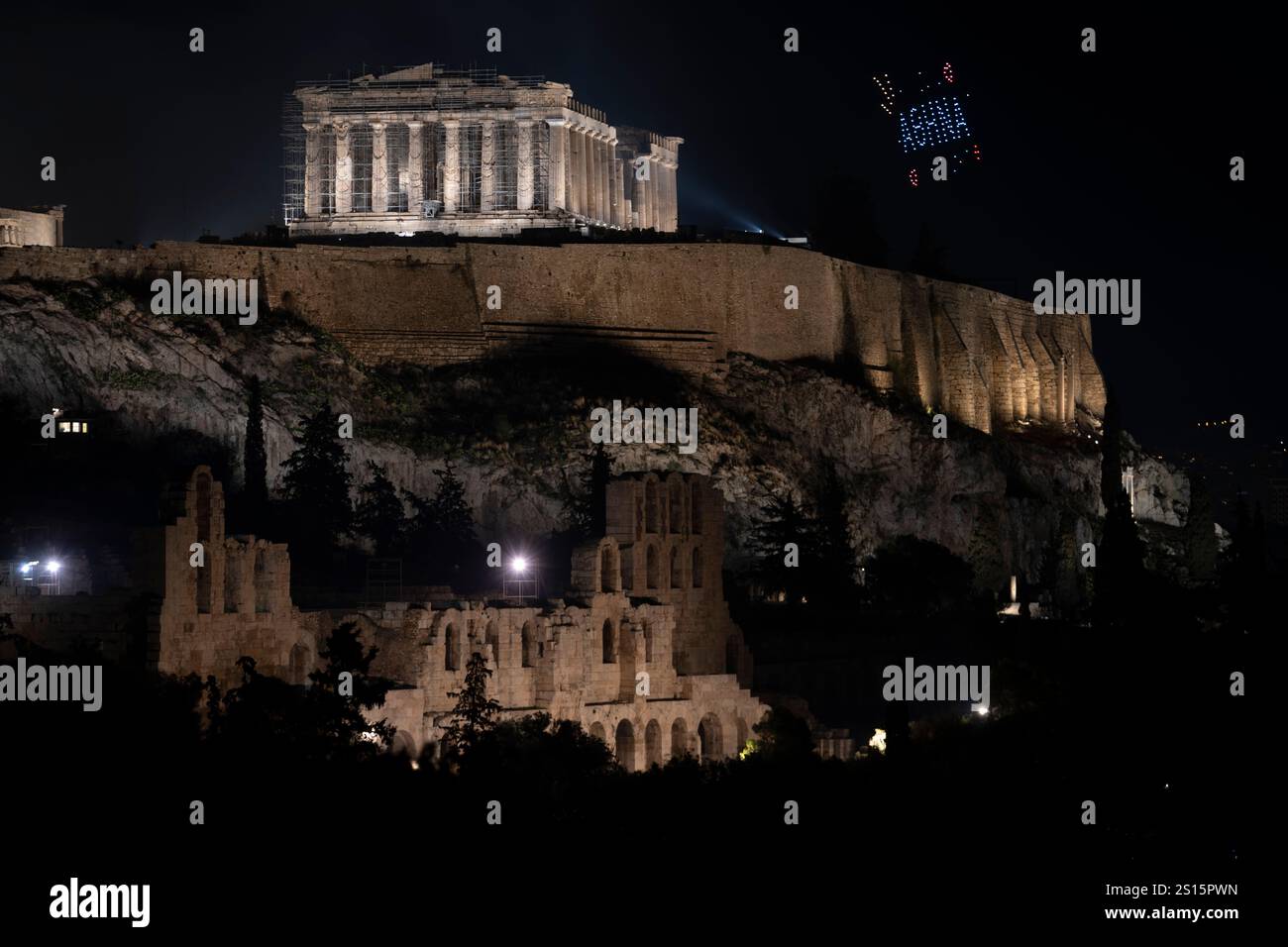 Drones form the the word Athens in Greek next the ancient Parthenon temple at the Acropolis hill ...