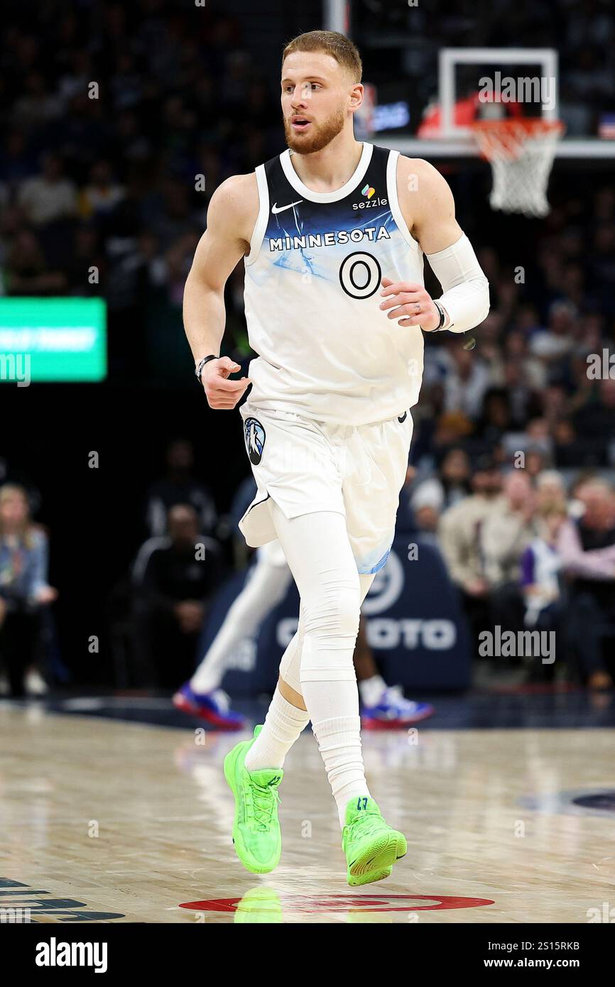 Minnesota Timberwolves guard Donte DiVincenzo (0) runs down the court ...