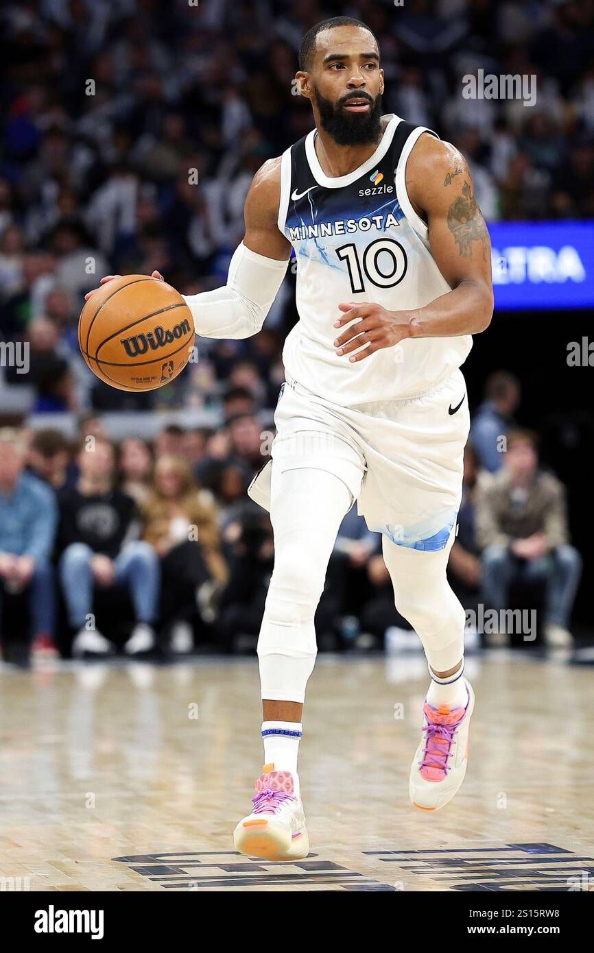 Minnesota Timberwolves guard Mike Conley (10) dribbles the ball down ...