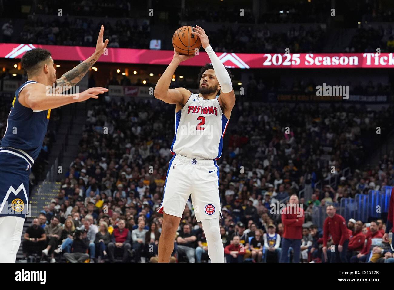Detroit Pistons guard Cade Cunningham (2) shoots over Denver Nuggets ...
