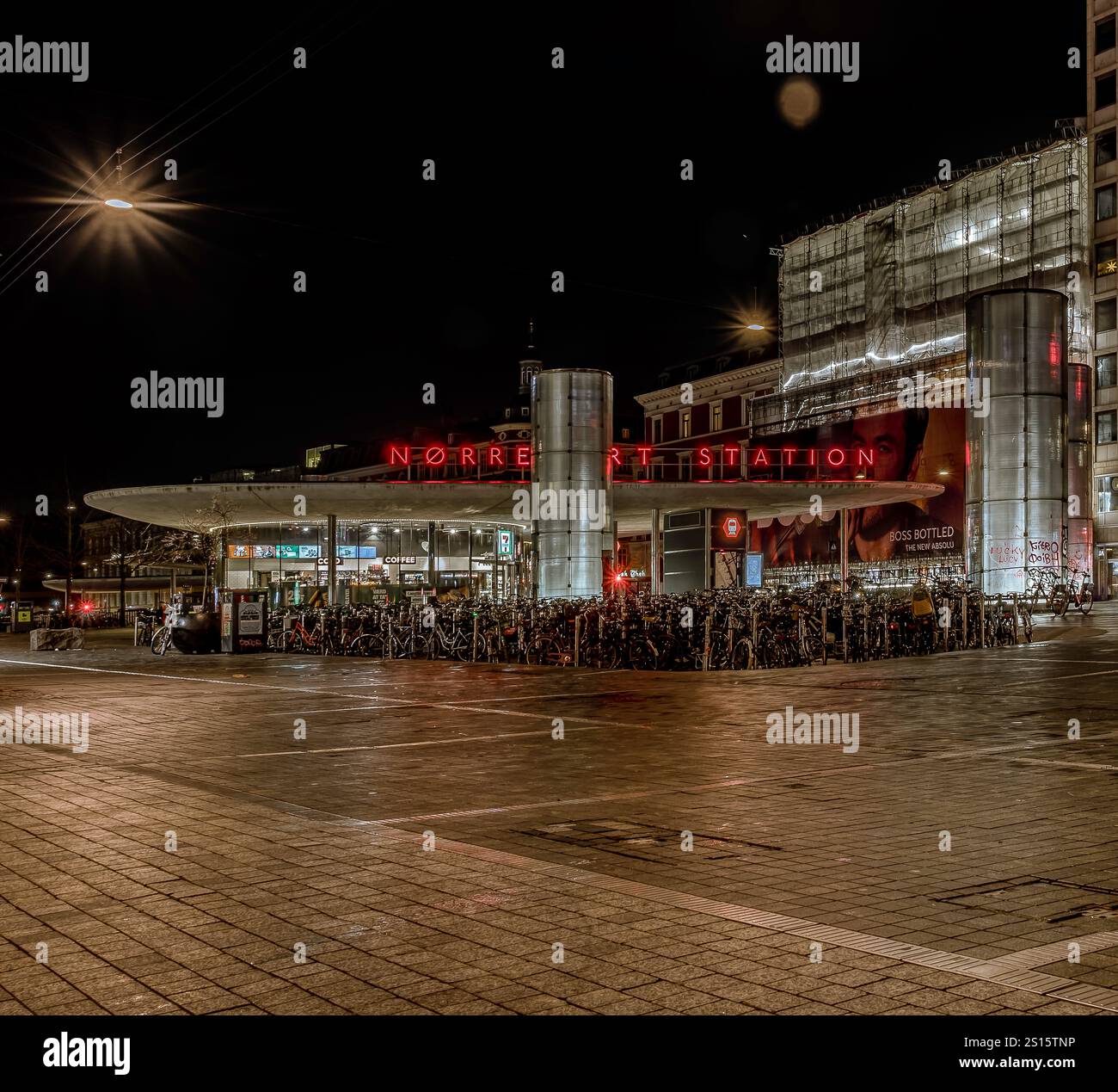 Norreport station in Copenhagen at night with reflective neon signs in ...