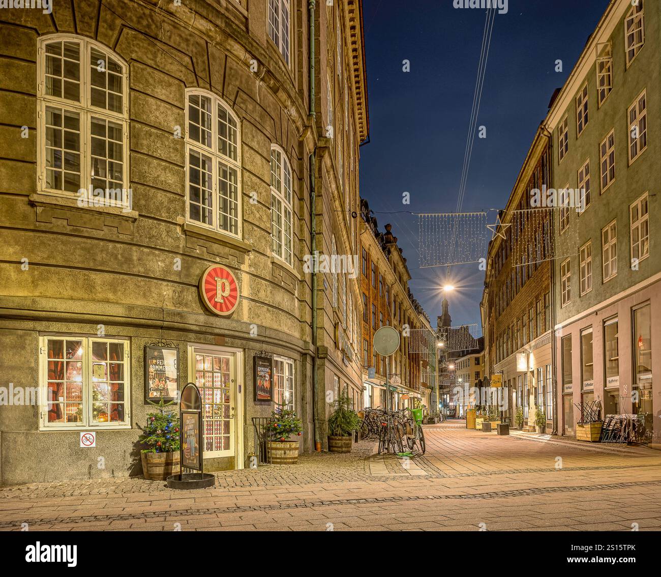 The Copenhagen street Filostraede with illuminated old houses in a ...