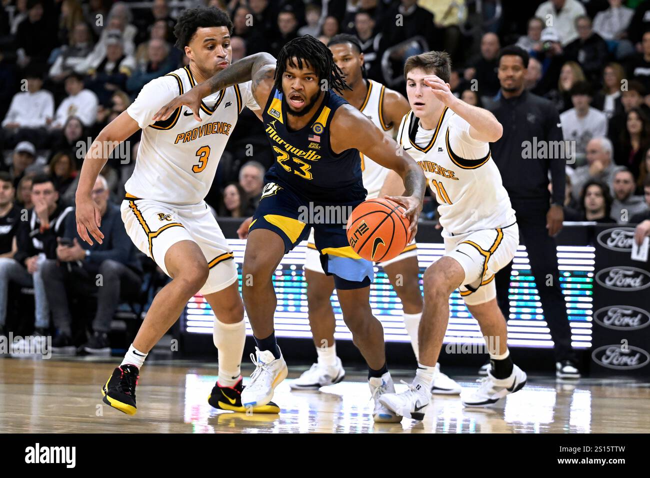 Marquette forward David Joplin (23) splits the defense of Providence ...