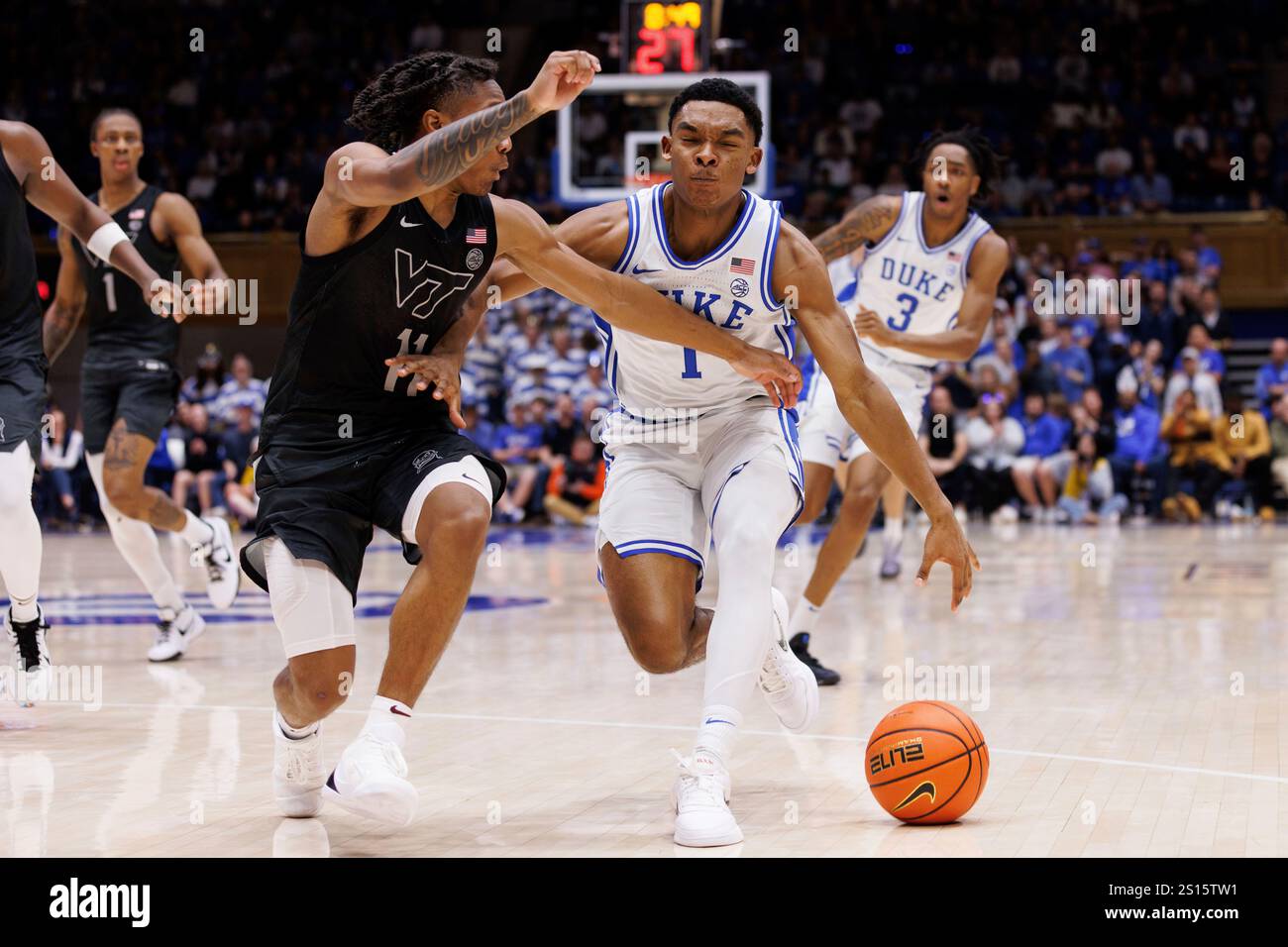 Duke's Caleb Foster (1) handles the ball as Virginia Tech's Ben Hammond ...