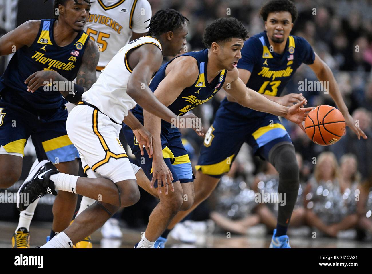 Marquette guard Stevie Mitchell, front right, steals the ball from Providence guard Jayden ...