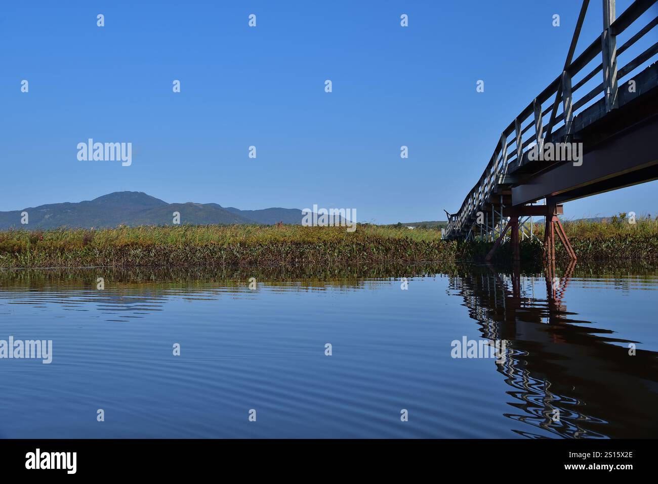 Magog Cherry river with Orford mount in the background. Pedestrian ...