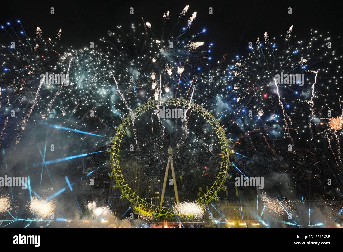 Fireworks light up the sky over the London Eye in central London during ...