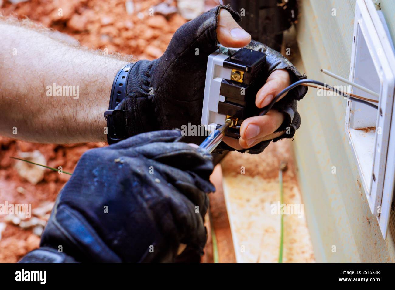 Process of connecting electrical wires to new outlet, crucial step in ...