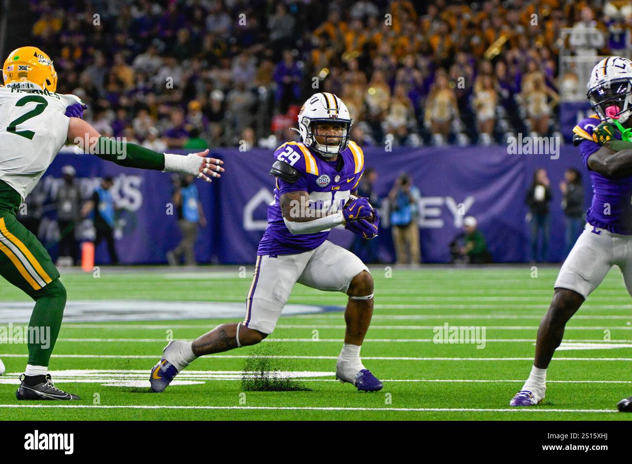 HOUSTON, TX - DECEMBER 31: LSU Tigers running back Caden Durham (29) finds a hole between two ...