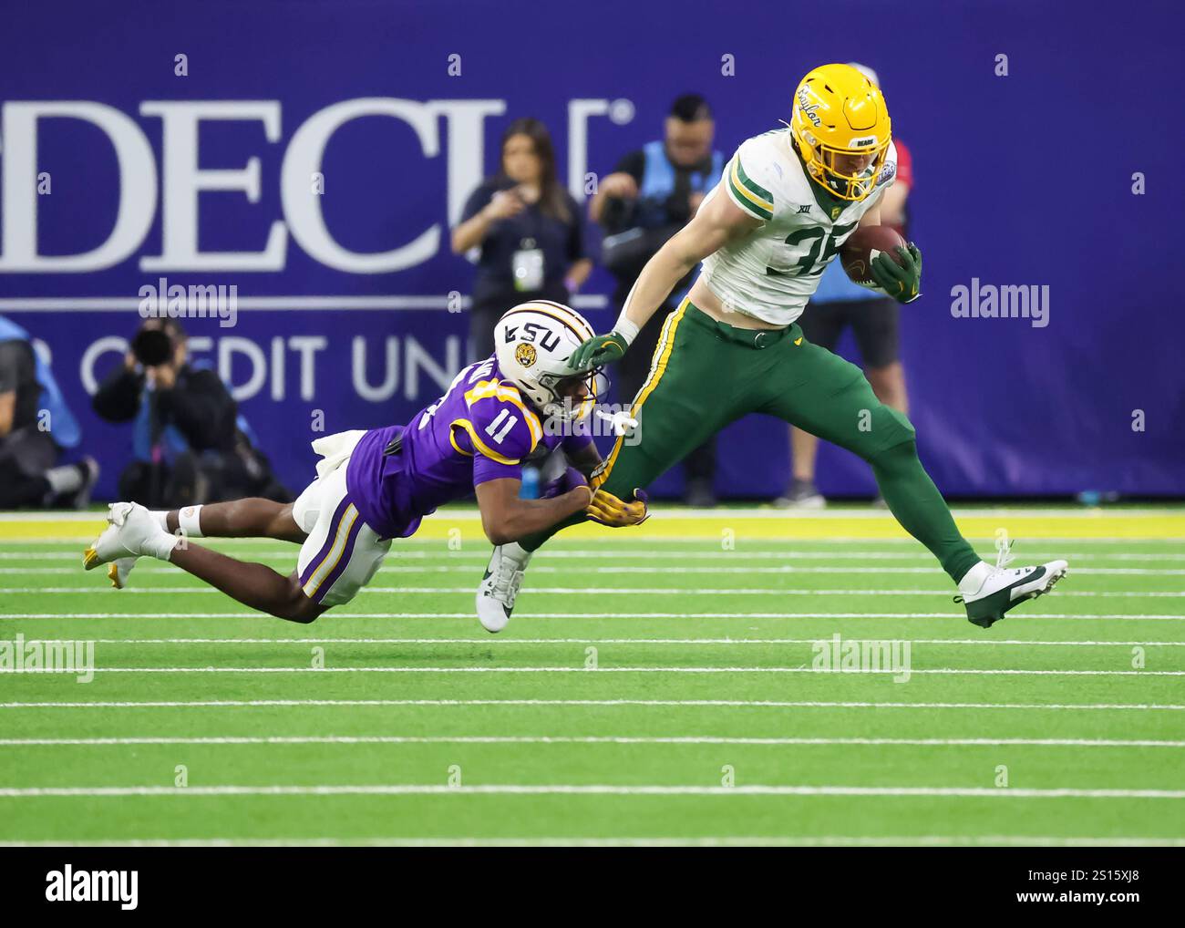 HOUSTON, TX - DECEMBER 31: LSU Tigers cornerback PJ Woodland (11) dives to tackle Baylor Bears ...