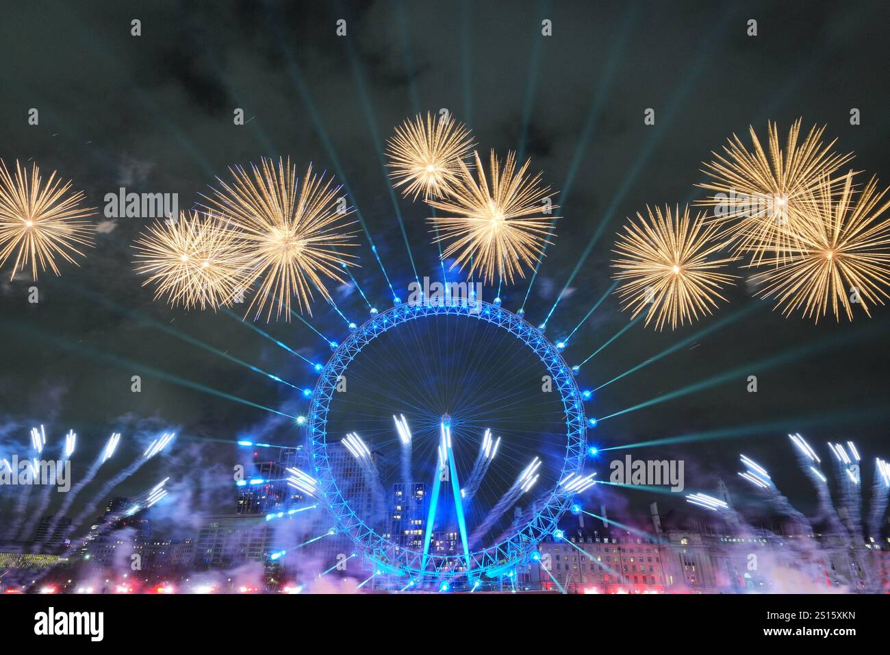 Fireworks light up the sky over the London Eye in central London during ...
