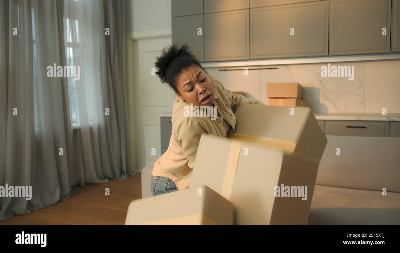 Female homeowner African American woman tenant moving in new home ...