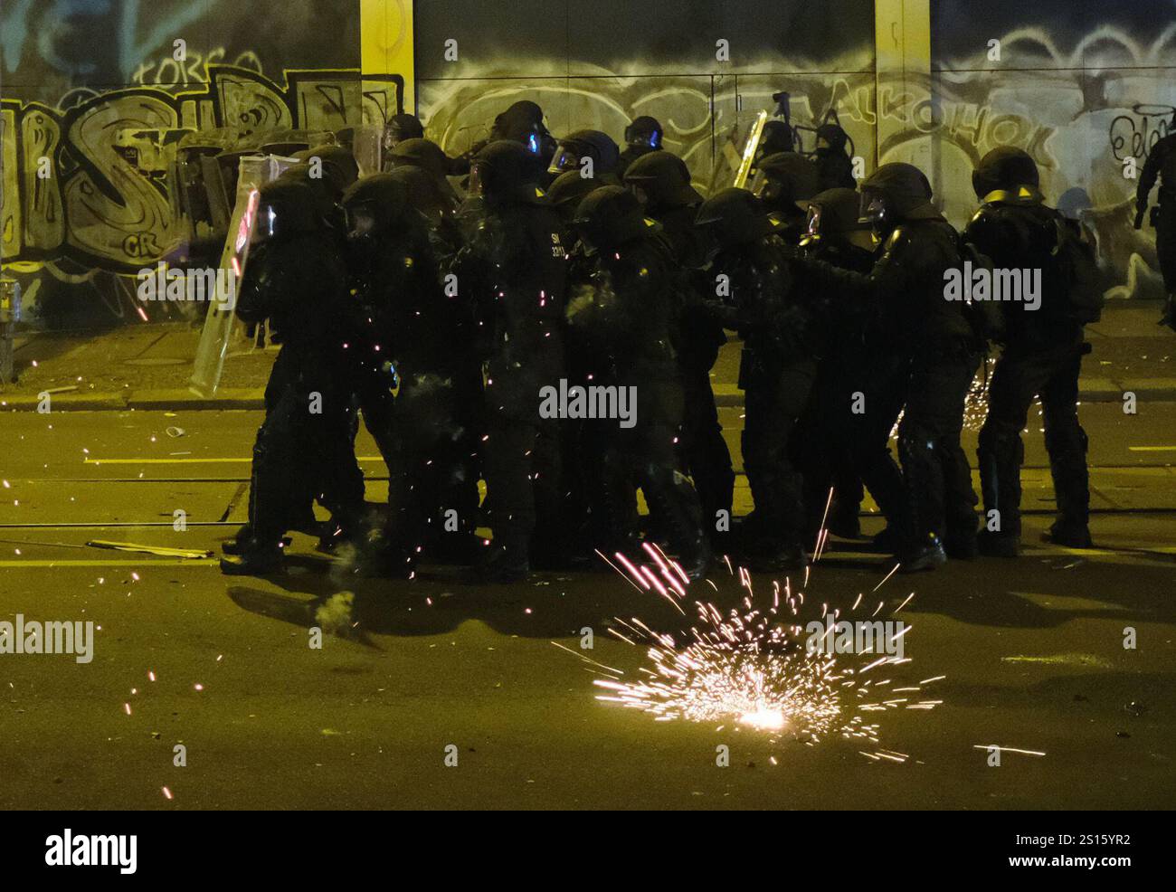 Leipzig, Germany. 01st Jan, 2025. Police officers are pelted with ...