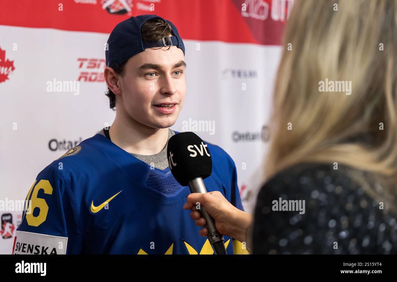 Felix Unger Sörum of, Sweden. , . in the mixed zone after the 2025 IIHF ...