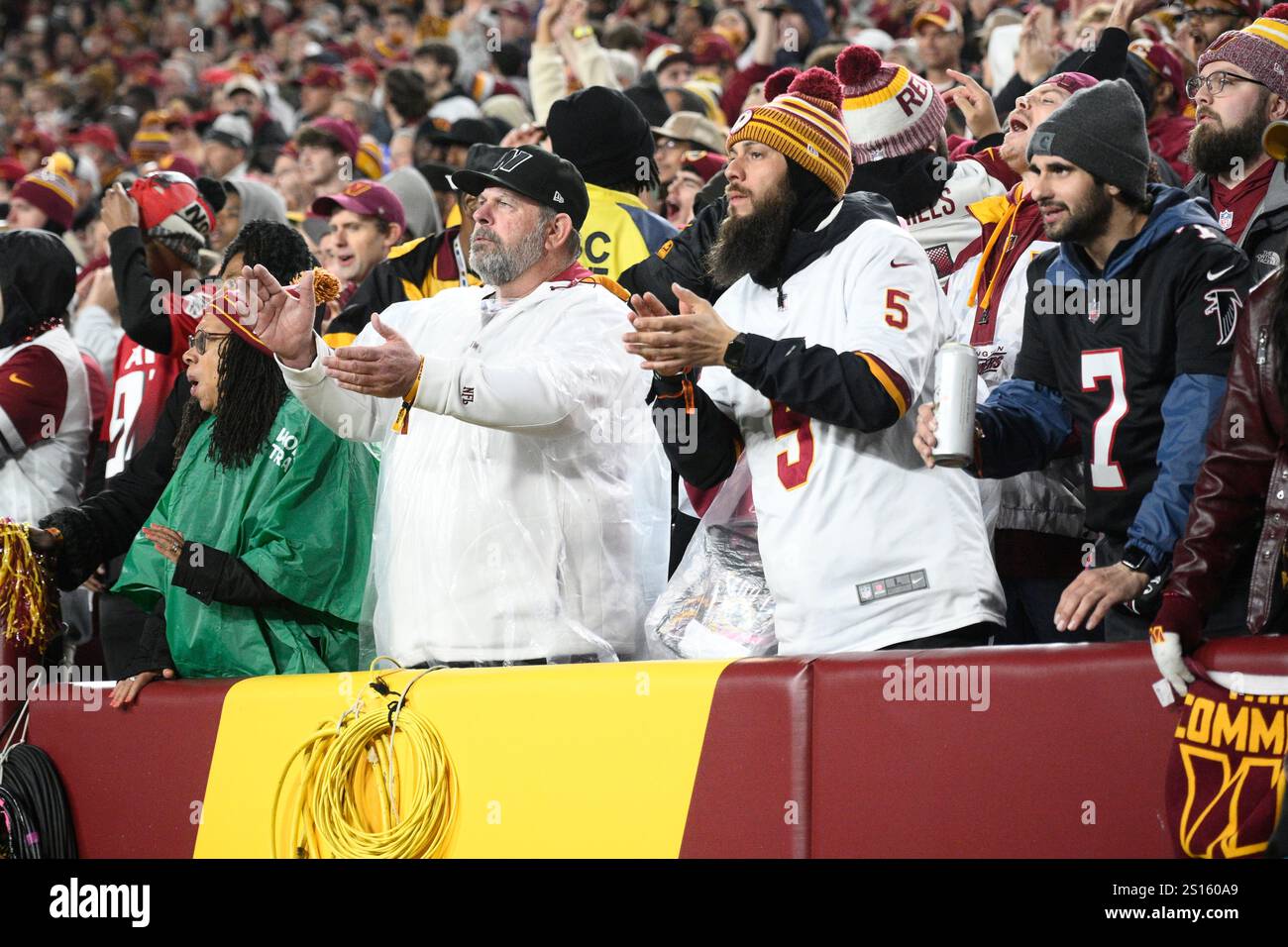 Spectators react during an NFL football game between the Washington ...