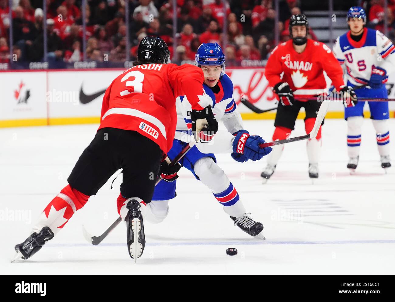 USA's Brandon Svoboda (8) tries to get past Canada's Sam Dickinson (3 ...