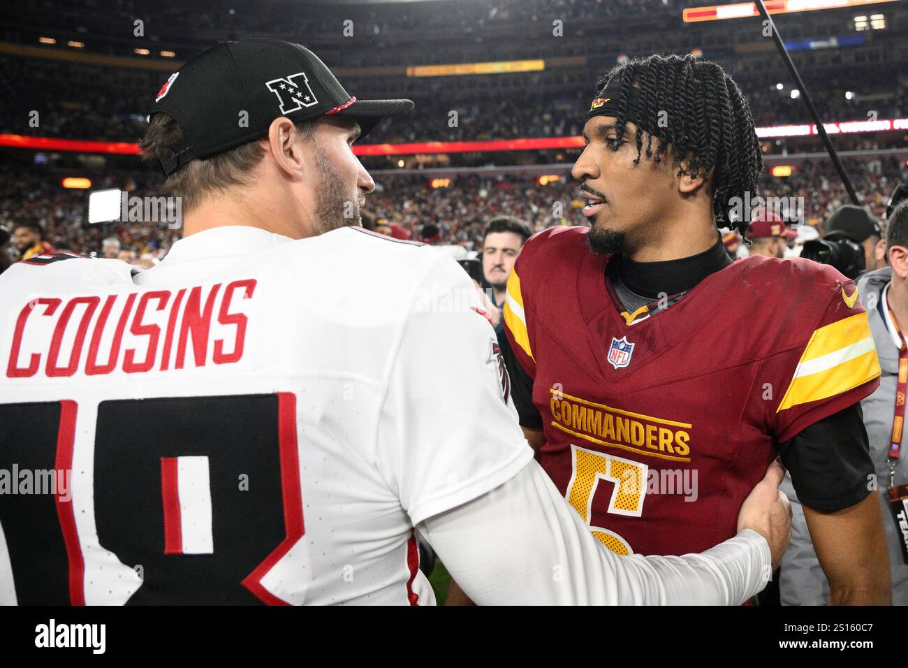 Washington Commanders quarterback Jayden Daniels (5) and Atlanta Falcons quarterback Kirk ...