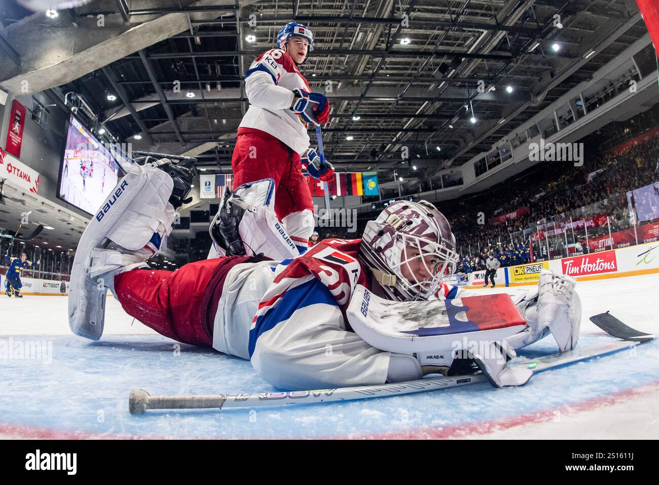 Matteo Koci and goaltender Michael Hrabal of, Czech Republic. , . look ...