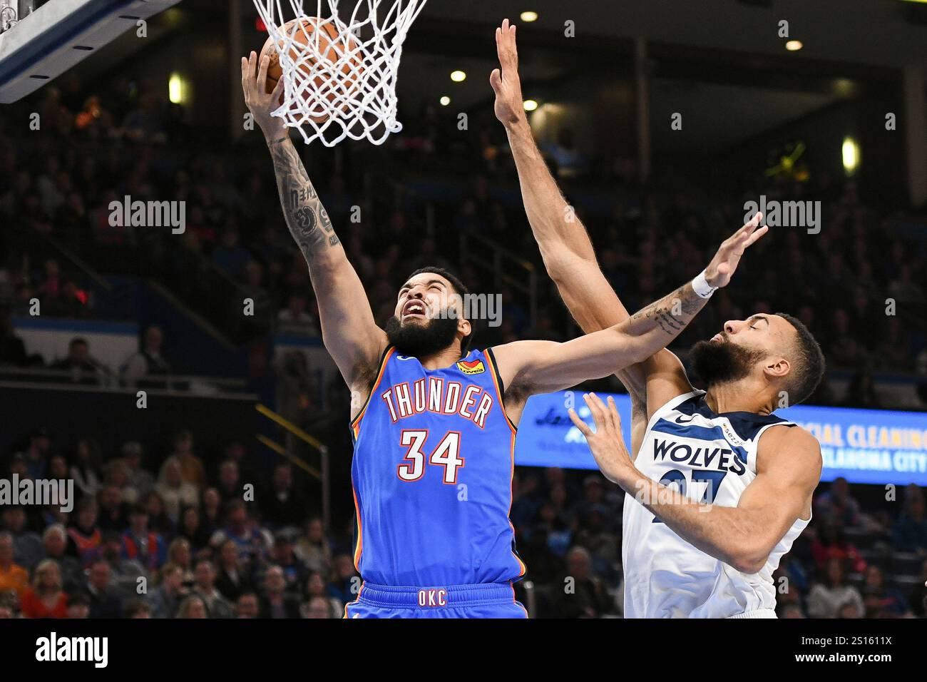Oklahoma City Thunder forward Kenrich Williams, left, shoots over ...
