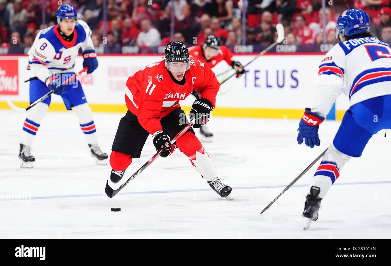 Ottawa, Canada. 31st Dec, 2024. Canada's Brayden Yager (11) skates with ...