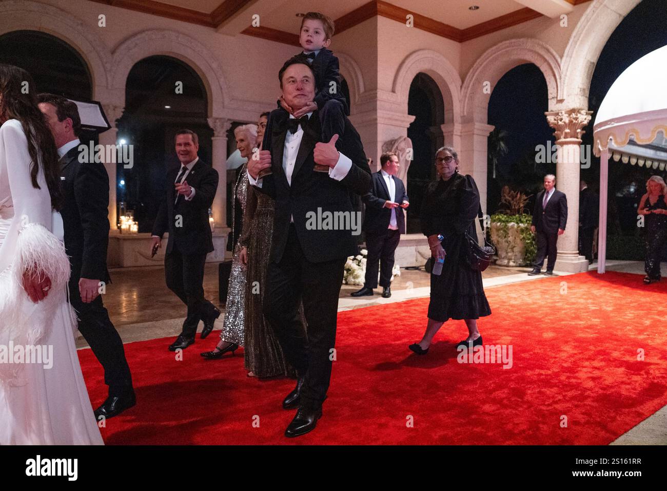 Elon Musk and his son, X AE A-Xii, arrive to a New Year's Eve party ...