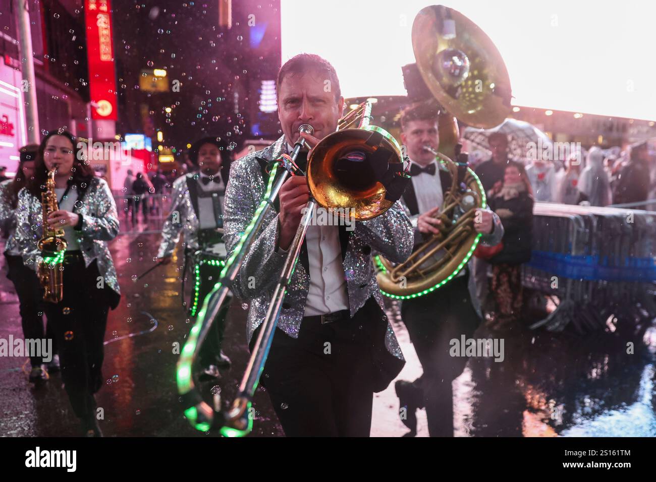 A performance takes place in the rain during the annual New Year's Eve ...