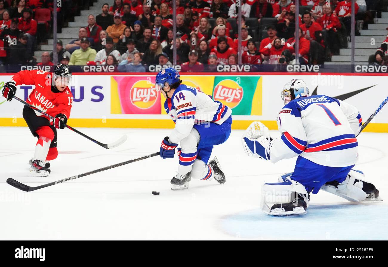Canada's Luca Pinelli (13) shoots against United States goaltender Trey ...