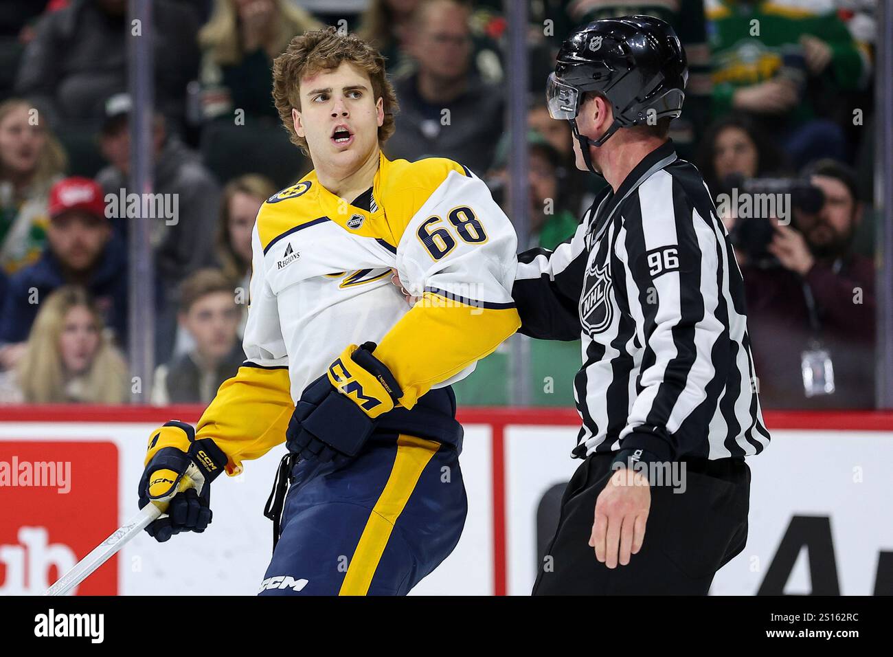 Nashville Predators left wing Zachary L'Heureux, left, is brought to ...