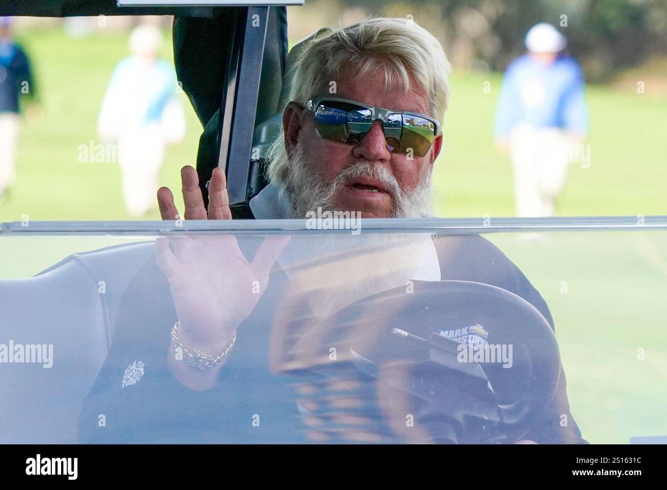 Orlando, Florida, USA. 22nd Dec, 2024. John Daly rides in a golf cart ...