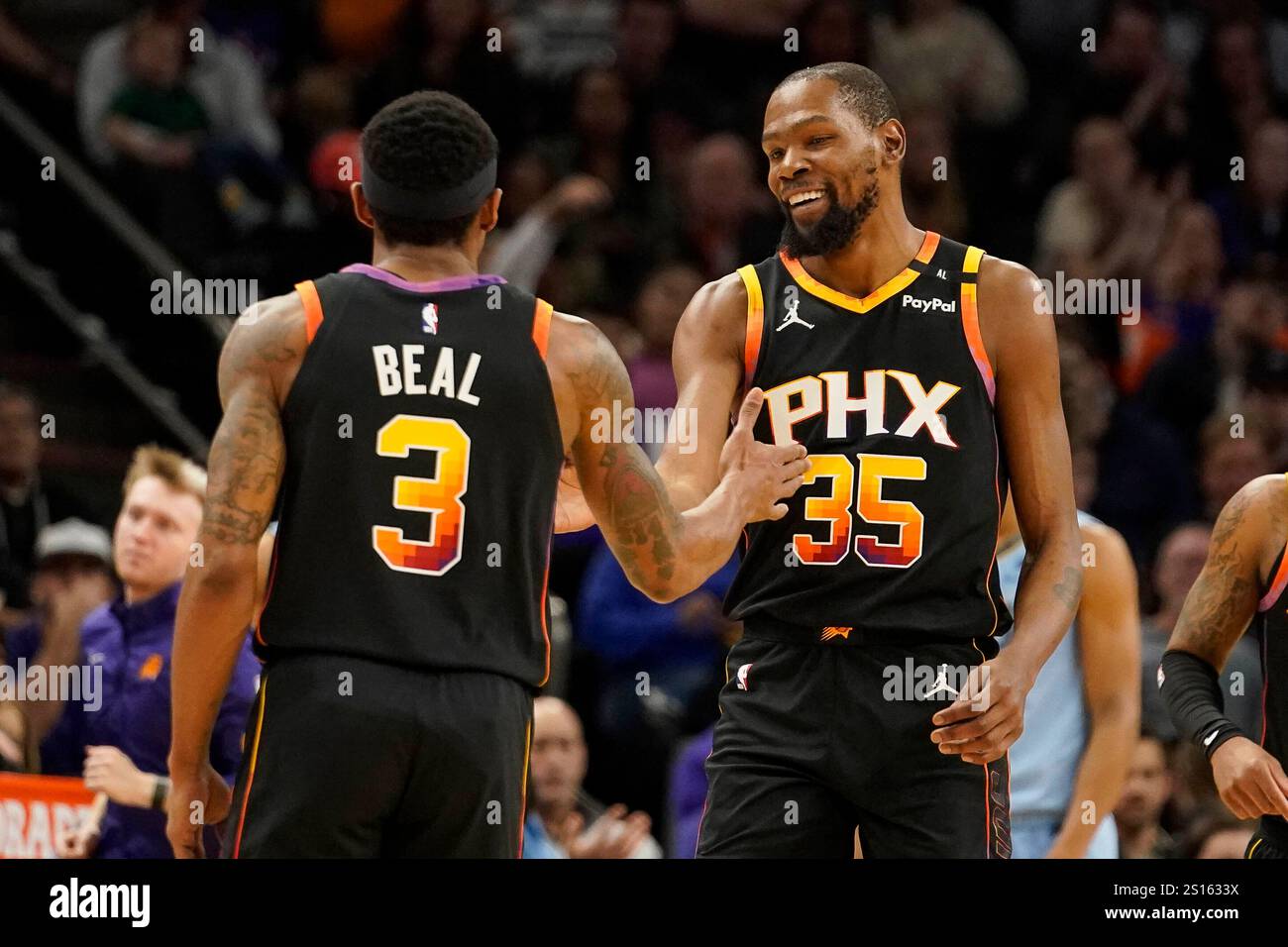 Phoenix Suns guard Bradley Beal (3) Kevin Durant (35) slap hands during ...
