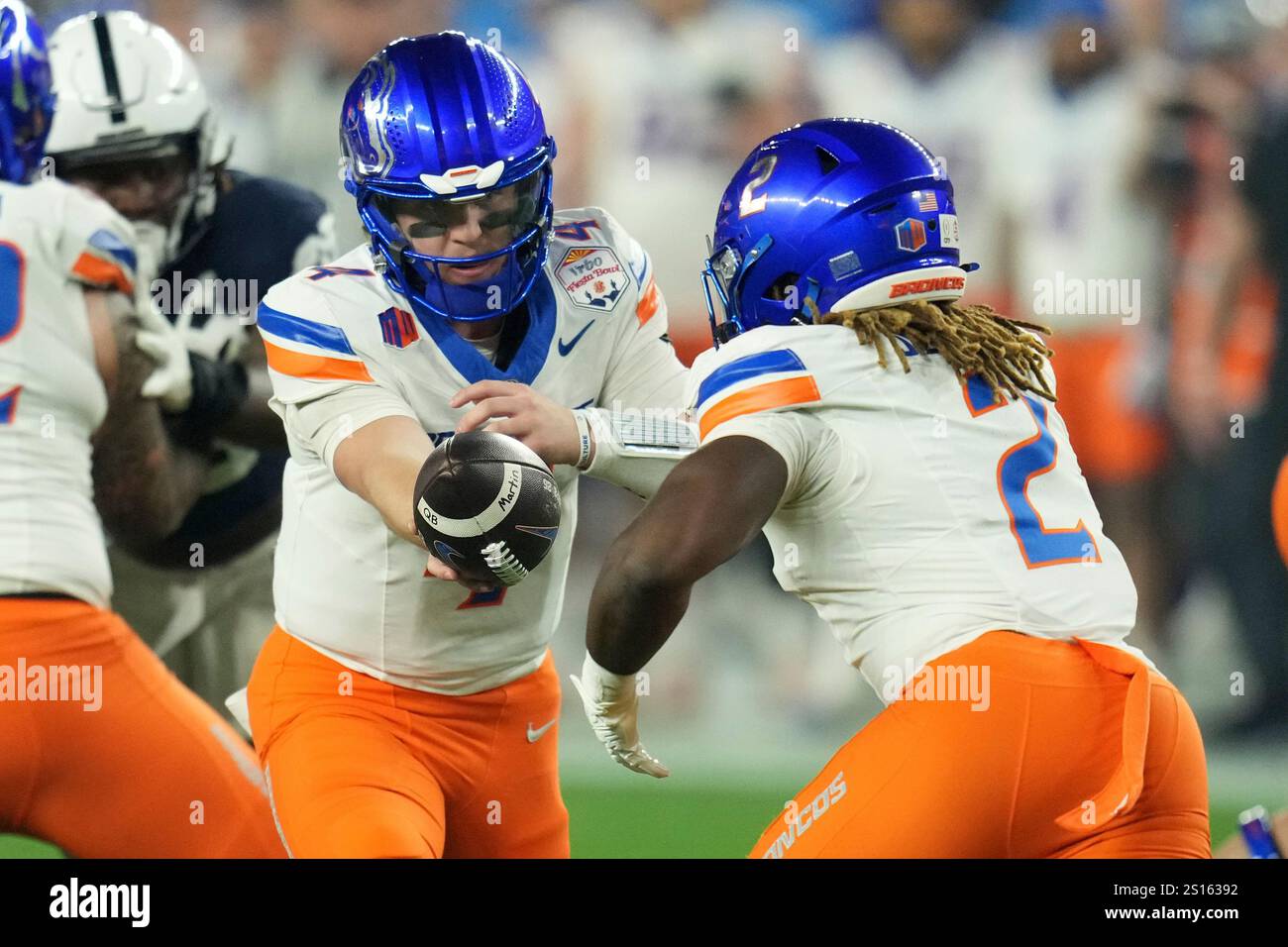 Boise State quarterback Maddux Madsen hands off to running back Ashton ...