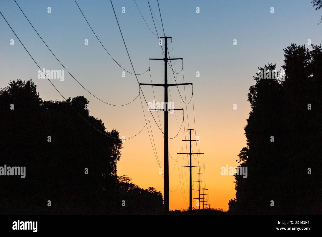 A row of power lines at sunset in Northeast Indiana, USA Stock Photo ...