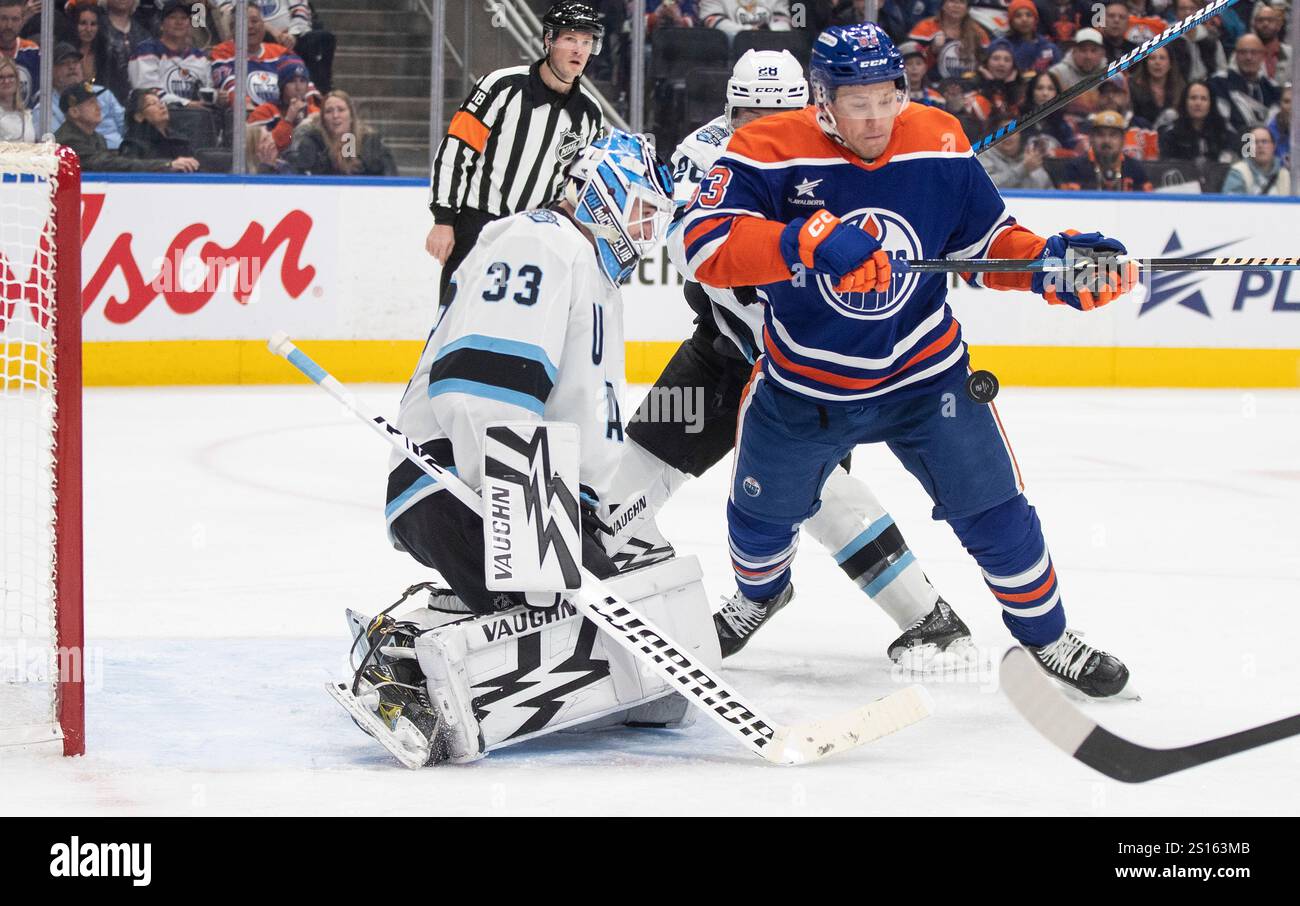 Utah Hockey Club goalie Jaxson Stauber (33) makes the save as Edmonton ...