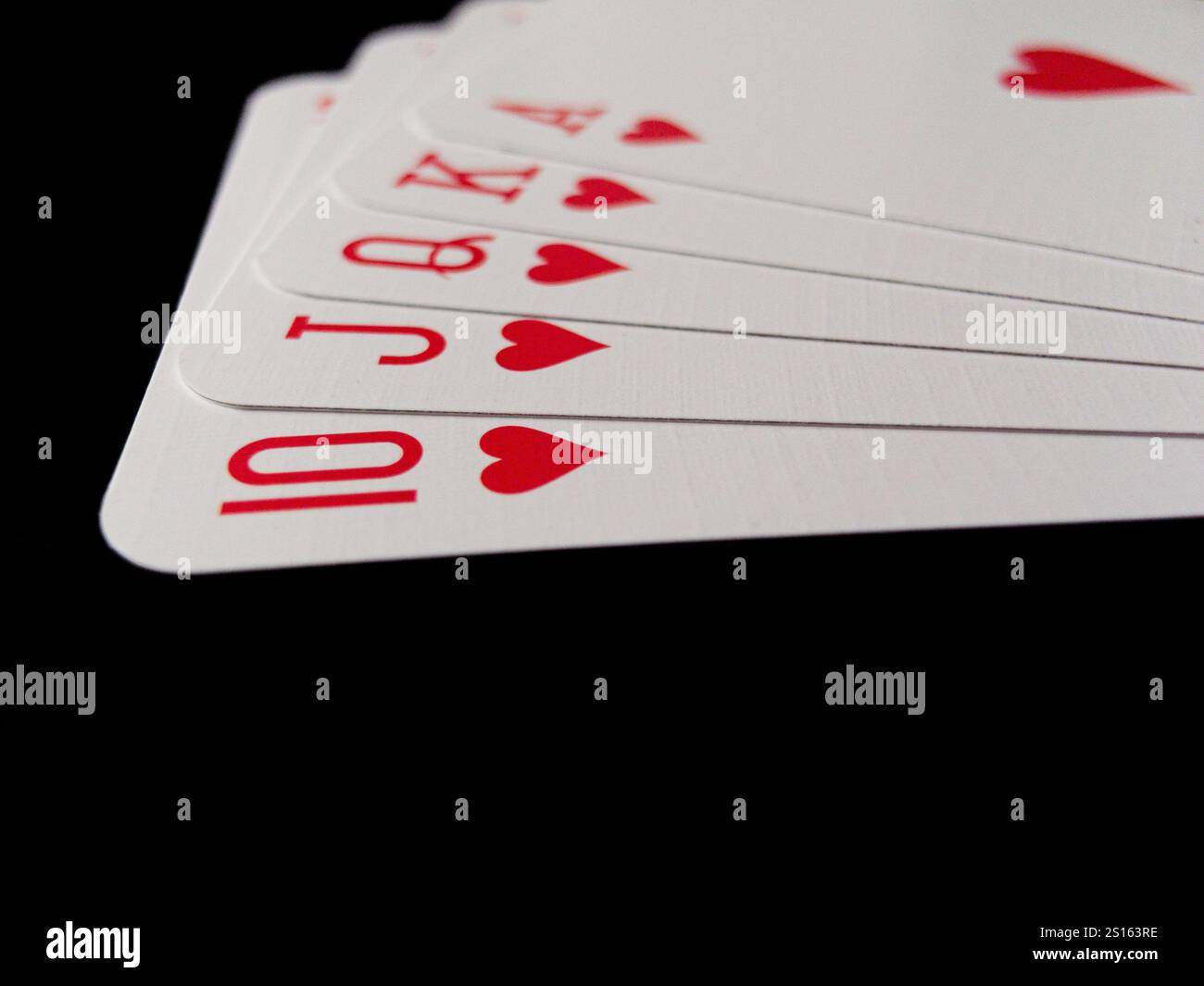 A deck of cards with the top card showing the King of Hearts. The ...