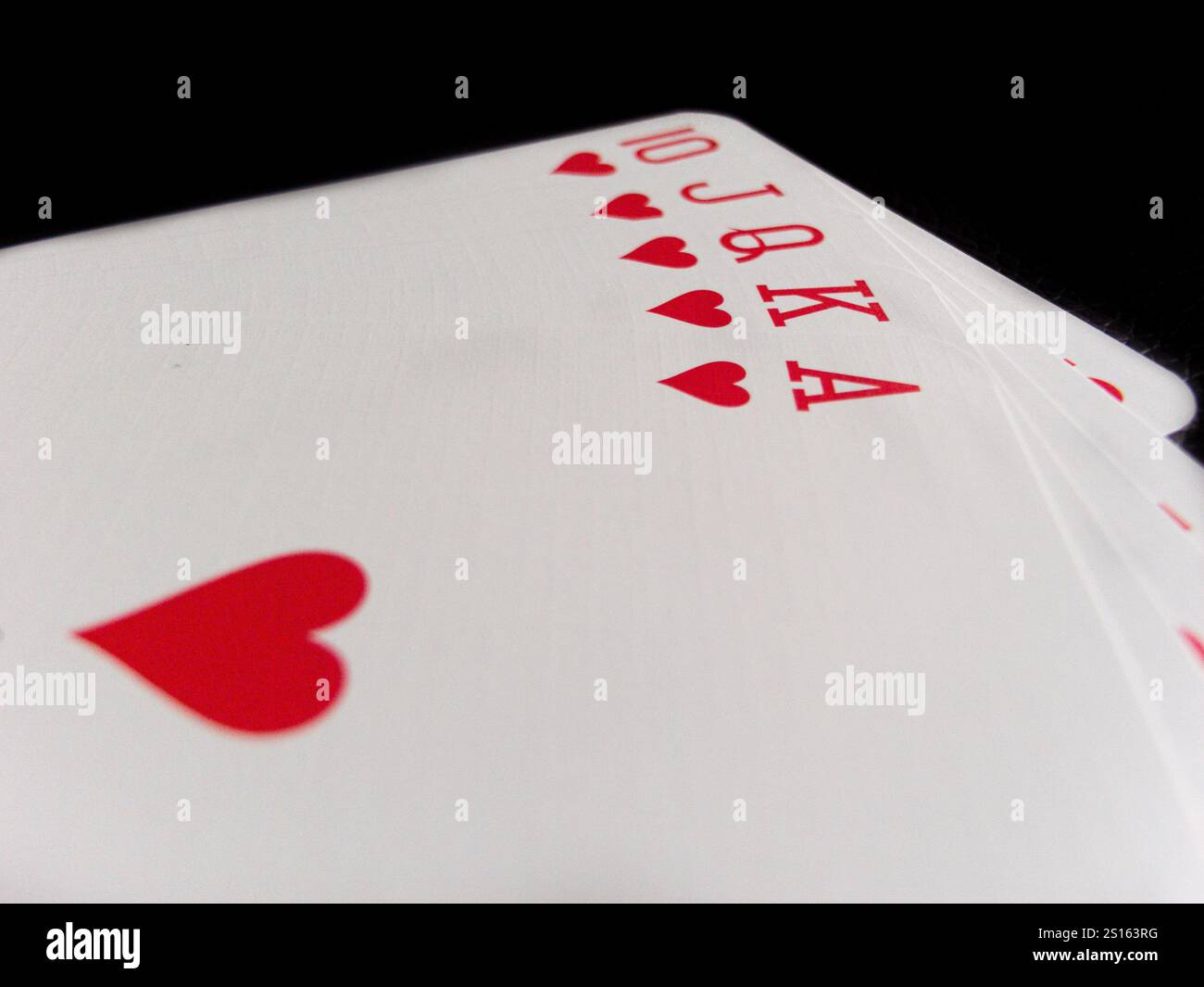 A deck of cards with the top card showing the King of Hearts. The ...