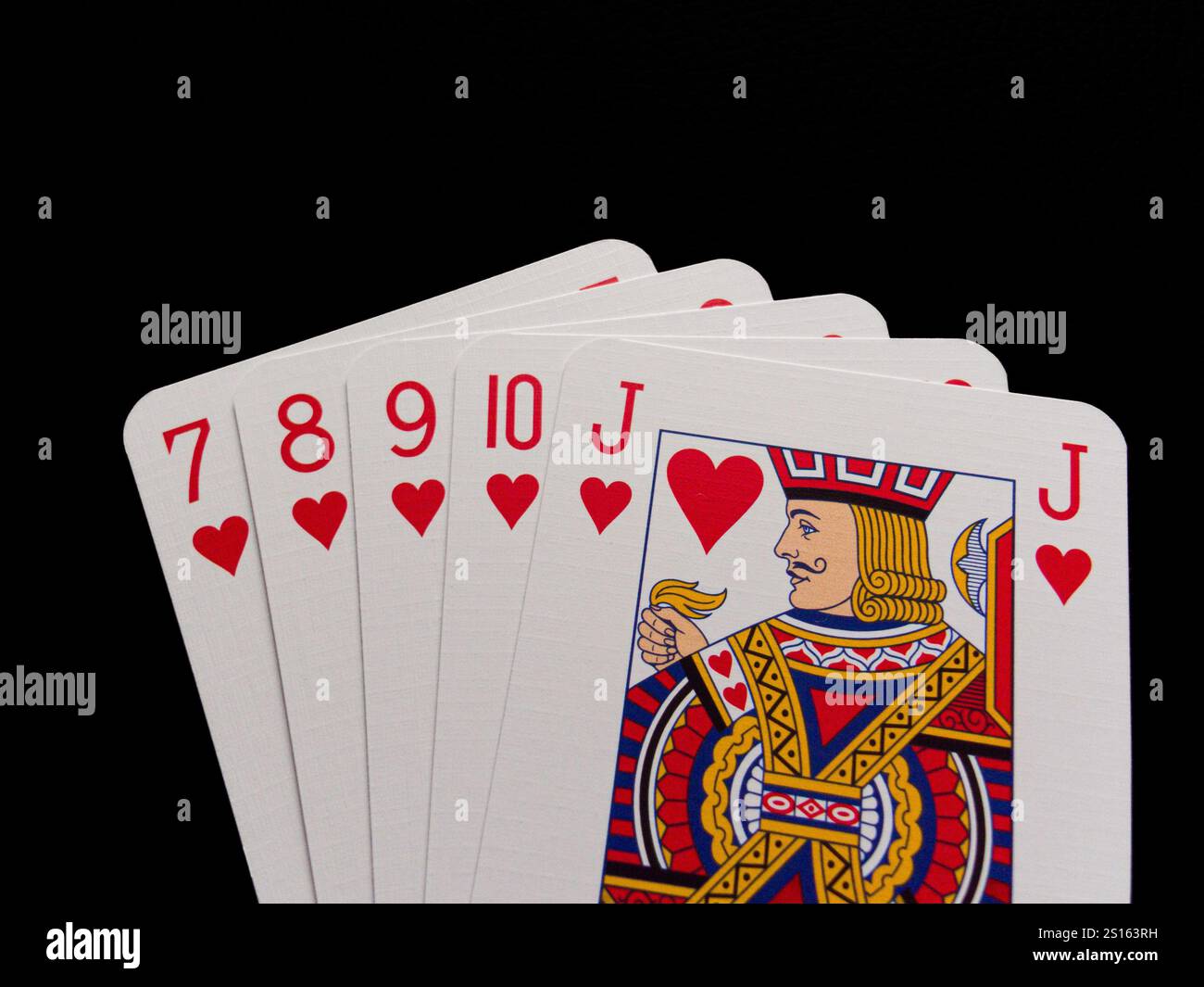 A deck of cards with the number 7 on the top left. The deck is made up ...