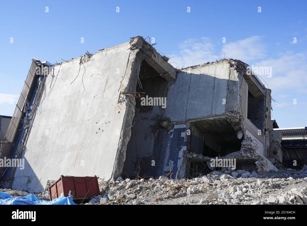 Demolition work is under way at a seven-story building in Wajima ...