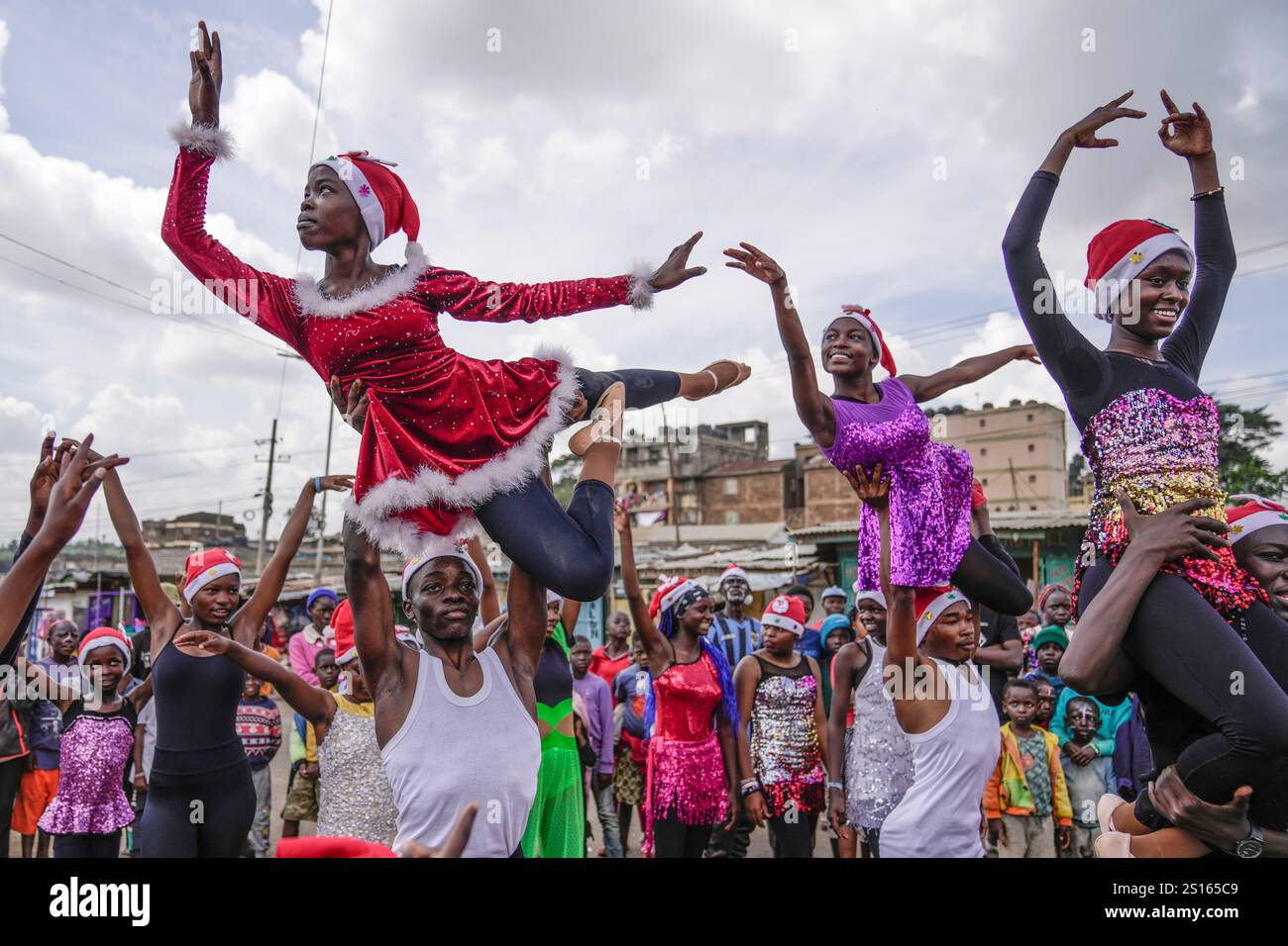 Young dancers perform, during a Christmas ballet event in Kibera slum ...
