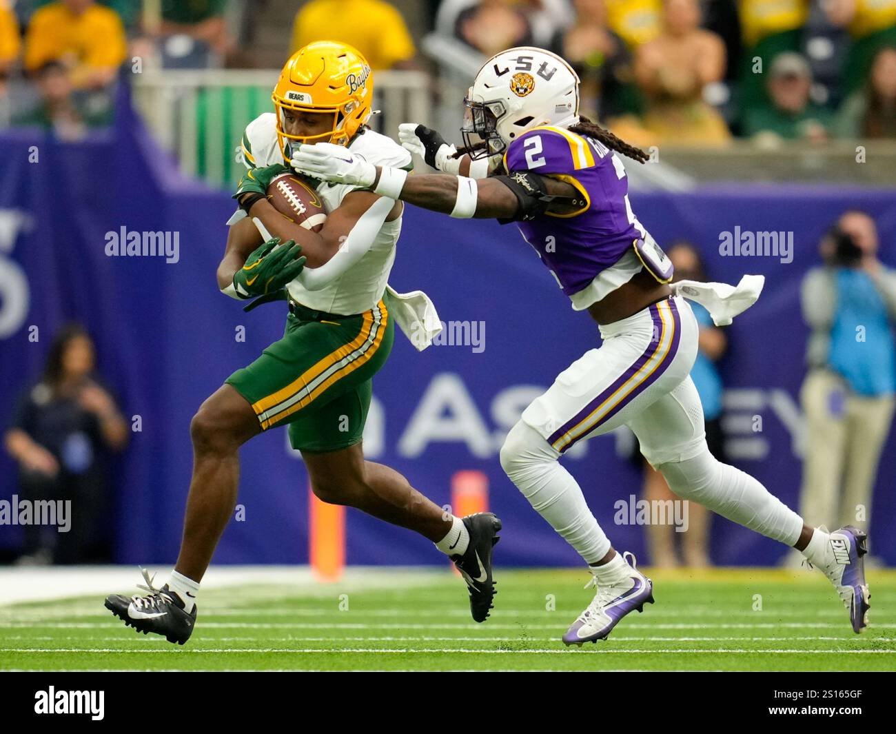 Safety Jardin Gilbert (LSU Tigers, #02) reaches out to tackle wide ...