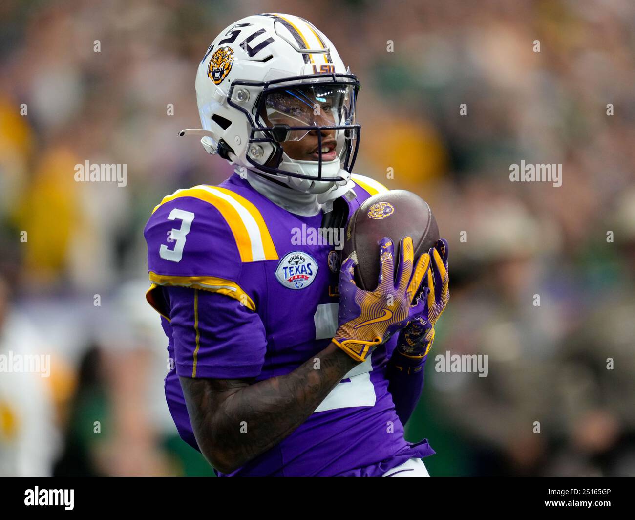 Wide receiver Chris Hilton Jr. (LSU Tigers, #03) makes a catch for a ...