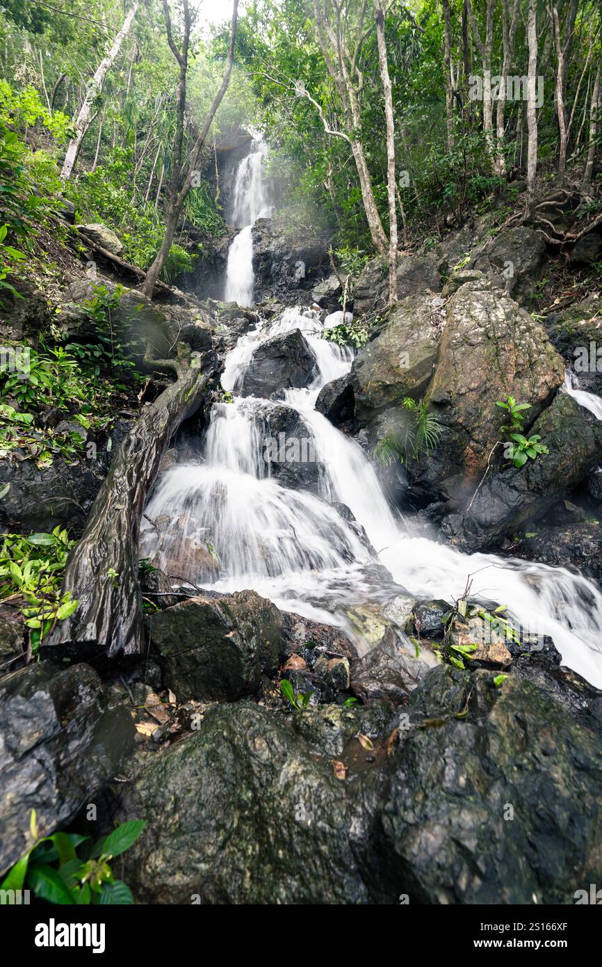 A stunning Diguisit Falls in Aurora cascading down moss-covered rocks ...