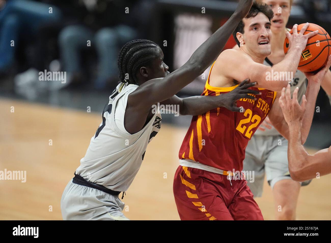 Iowa State forward Milan Momcilovic (22) and Colorado forward Assane ...