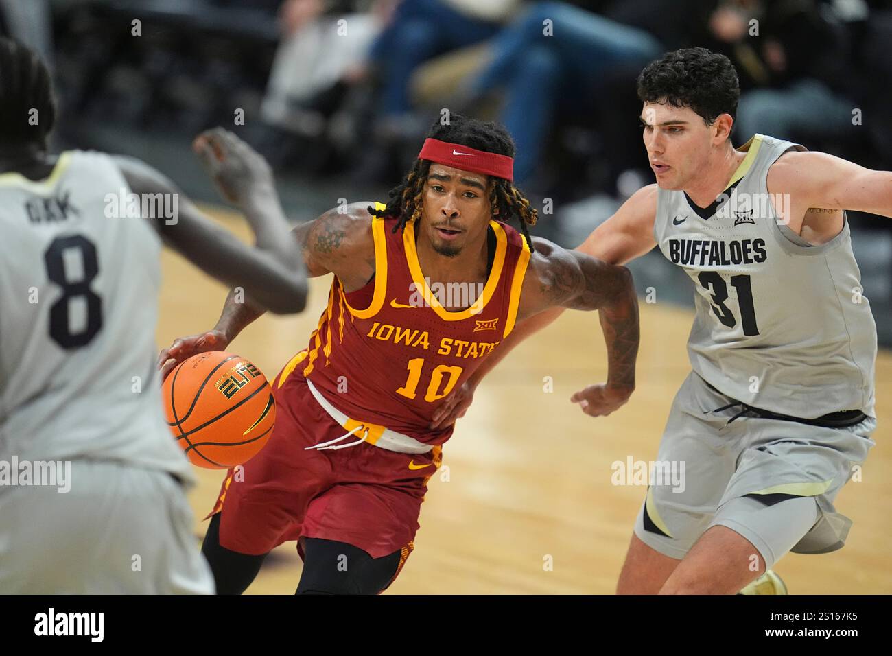 Iowa State guard Keshon Gilbert (10) and Colorado guard Harrison ...