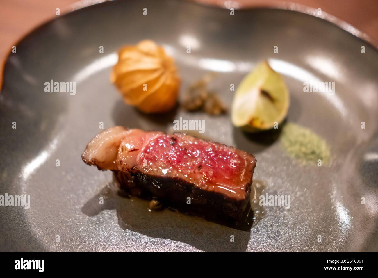 Medium rare Wagyu beef on plate Stock Photo - Alamy